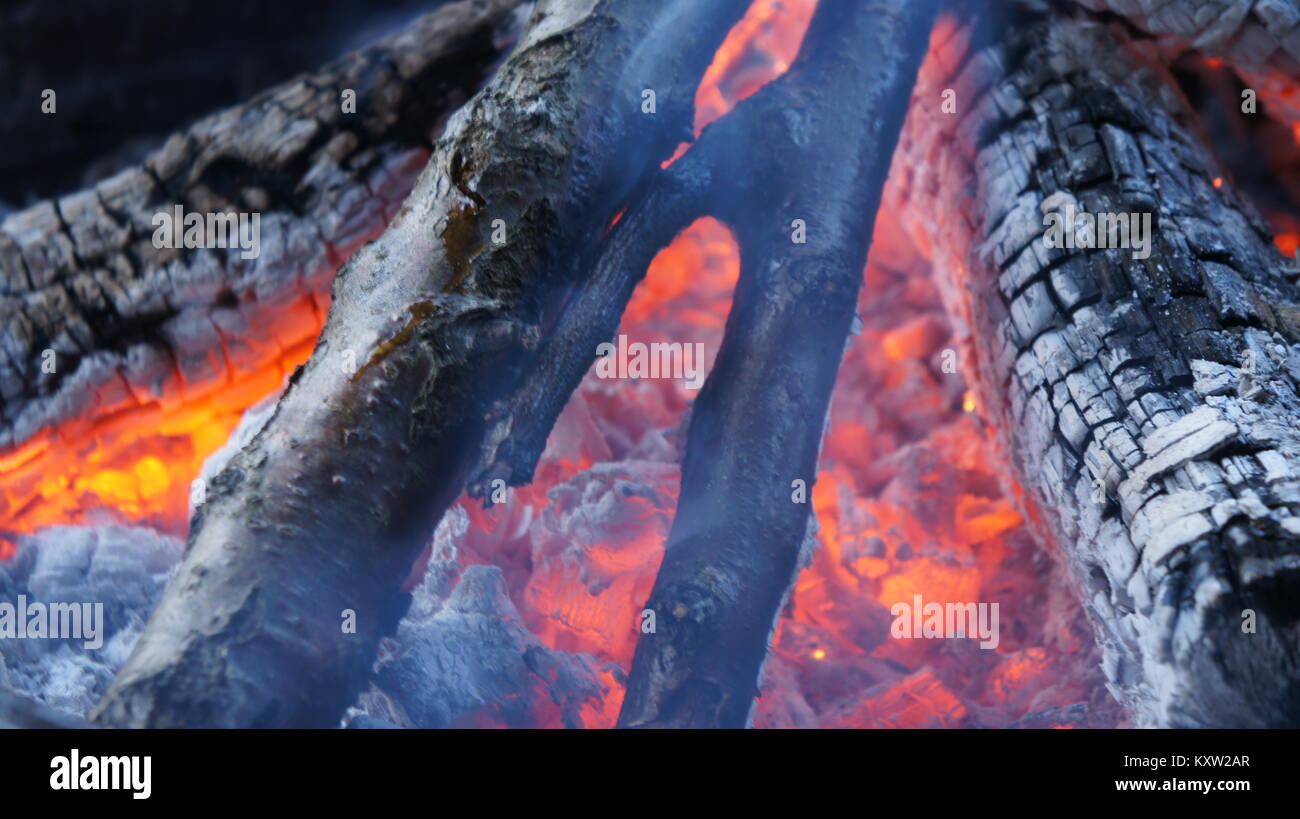 Burning fire wood. Close up of glowing coals and fire. as background ...