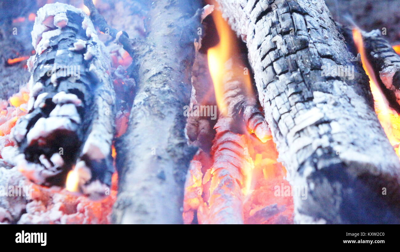 Burning fire wood. Close-up of glowing coals and fire. as background ...