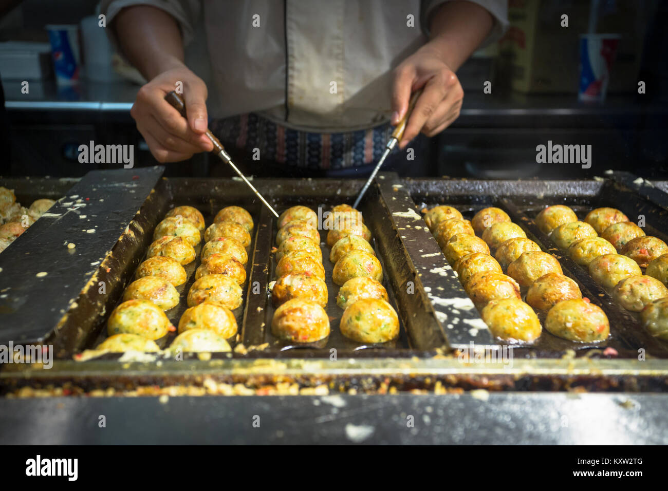 japanese chef cooking takoyaki, tagoyaki is the most popular delicious ...