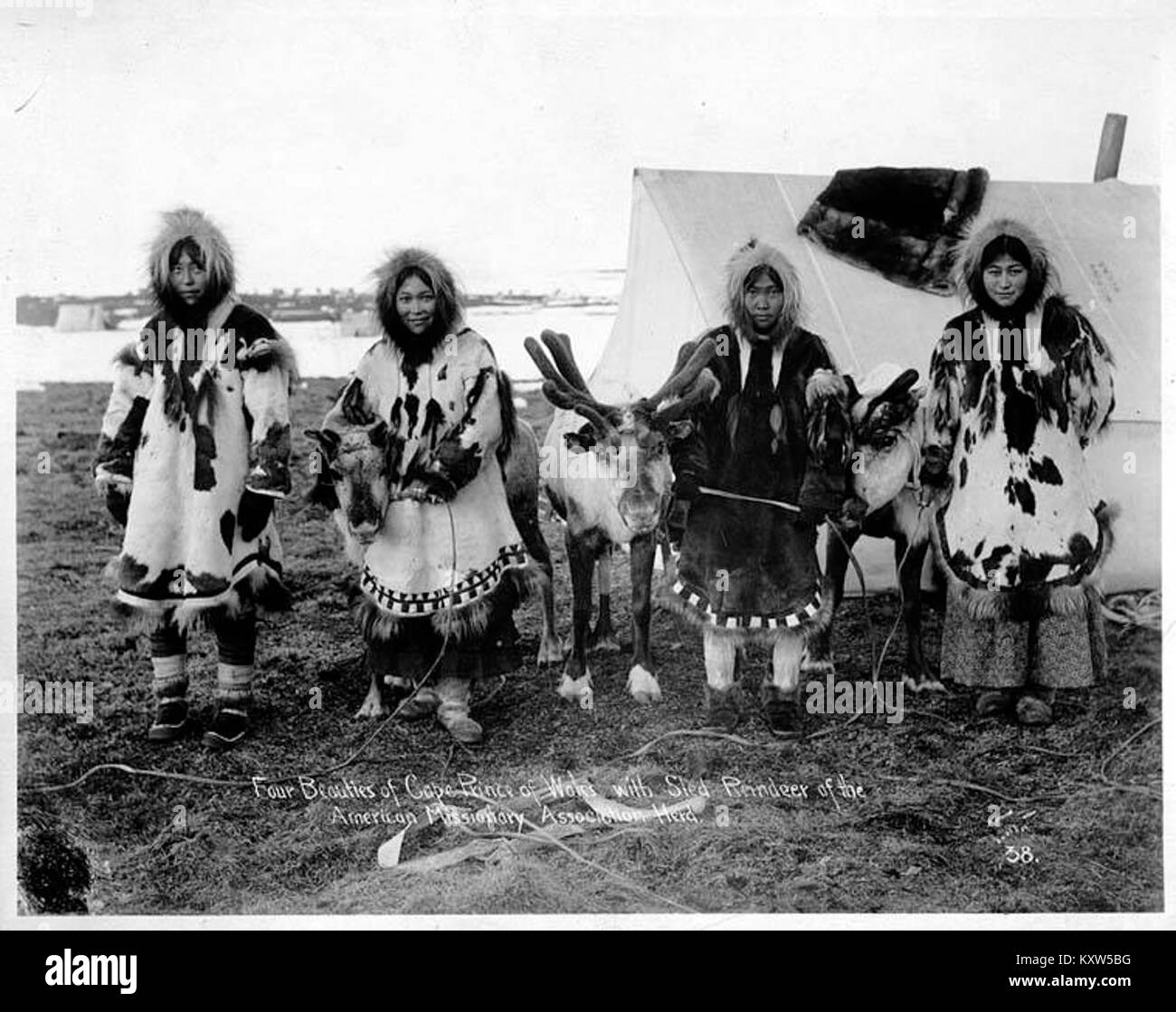 A historical photograph from around 1904, depicting four Eskimo women ...