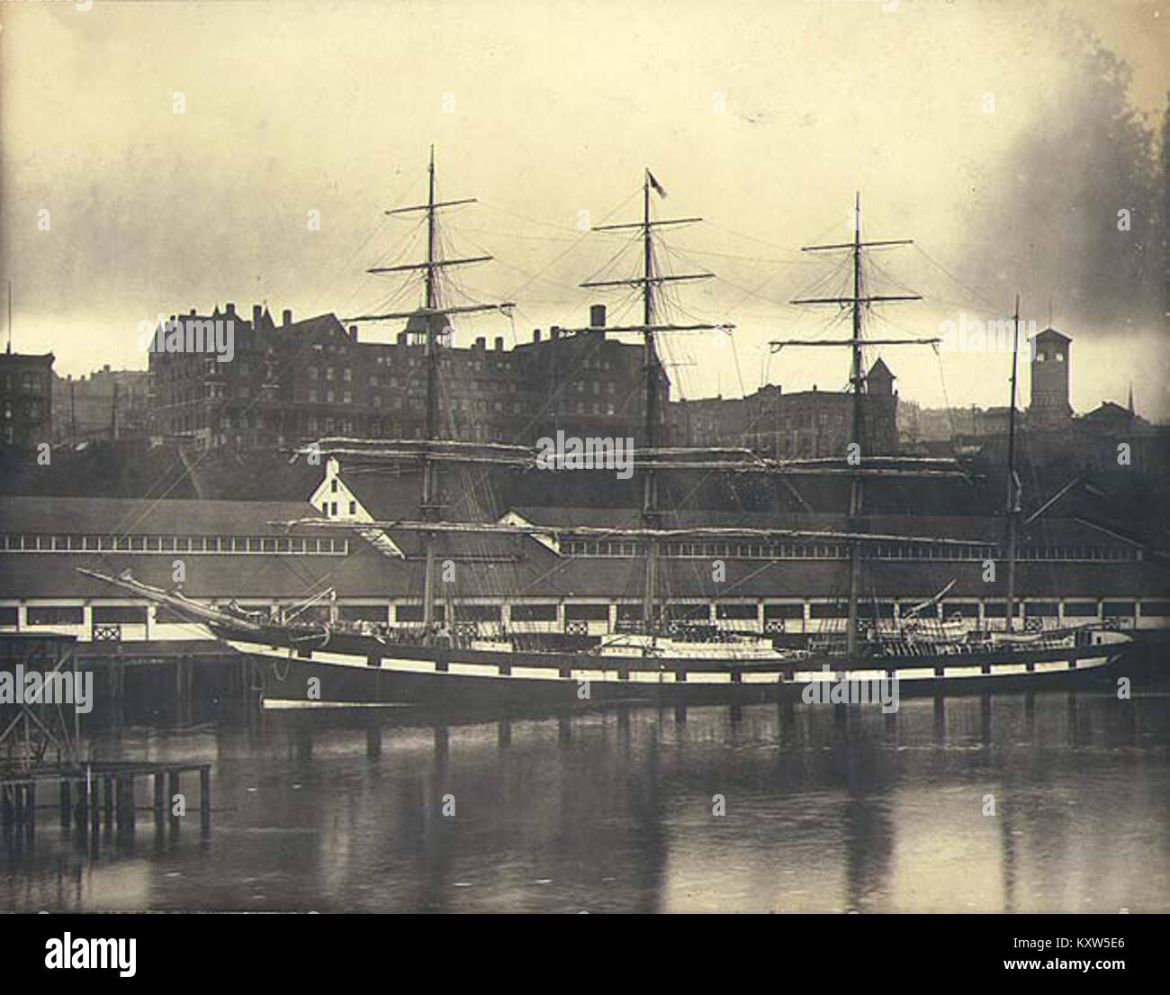 This photograph shows the four-masted bark Thekla docked at the ...