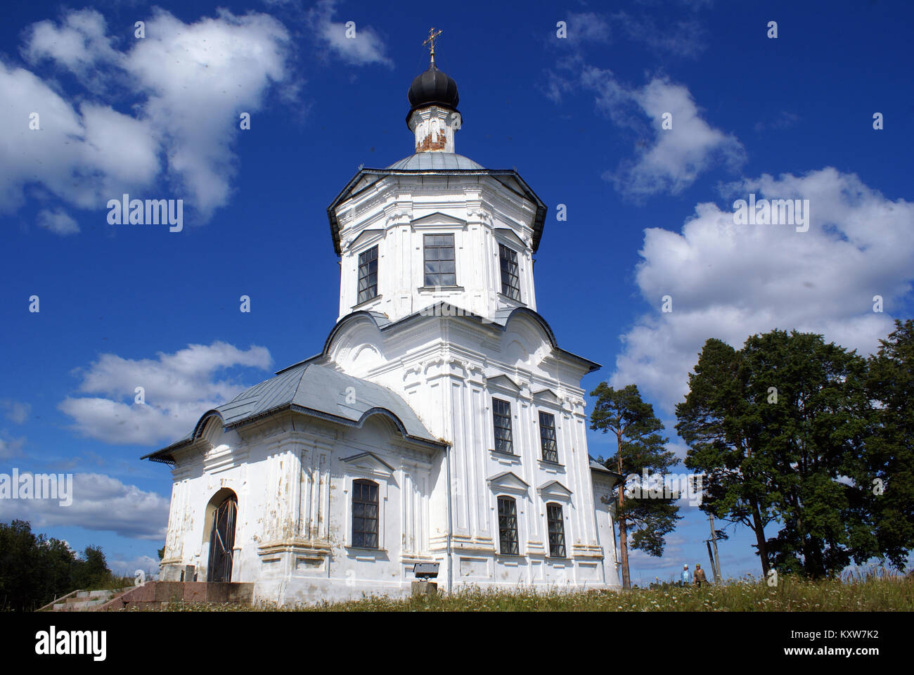 White church with golden cross in Nilova Pustyn, Seliger, Russia Stock ...