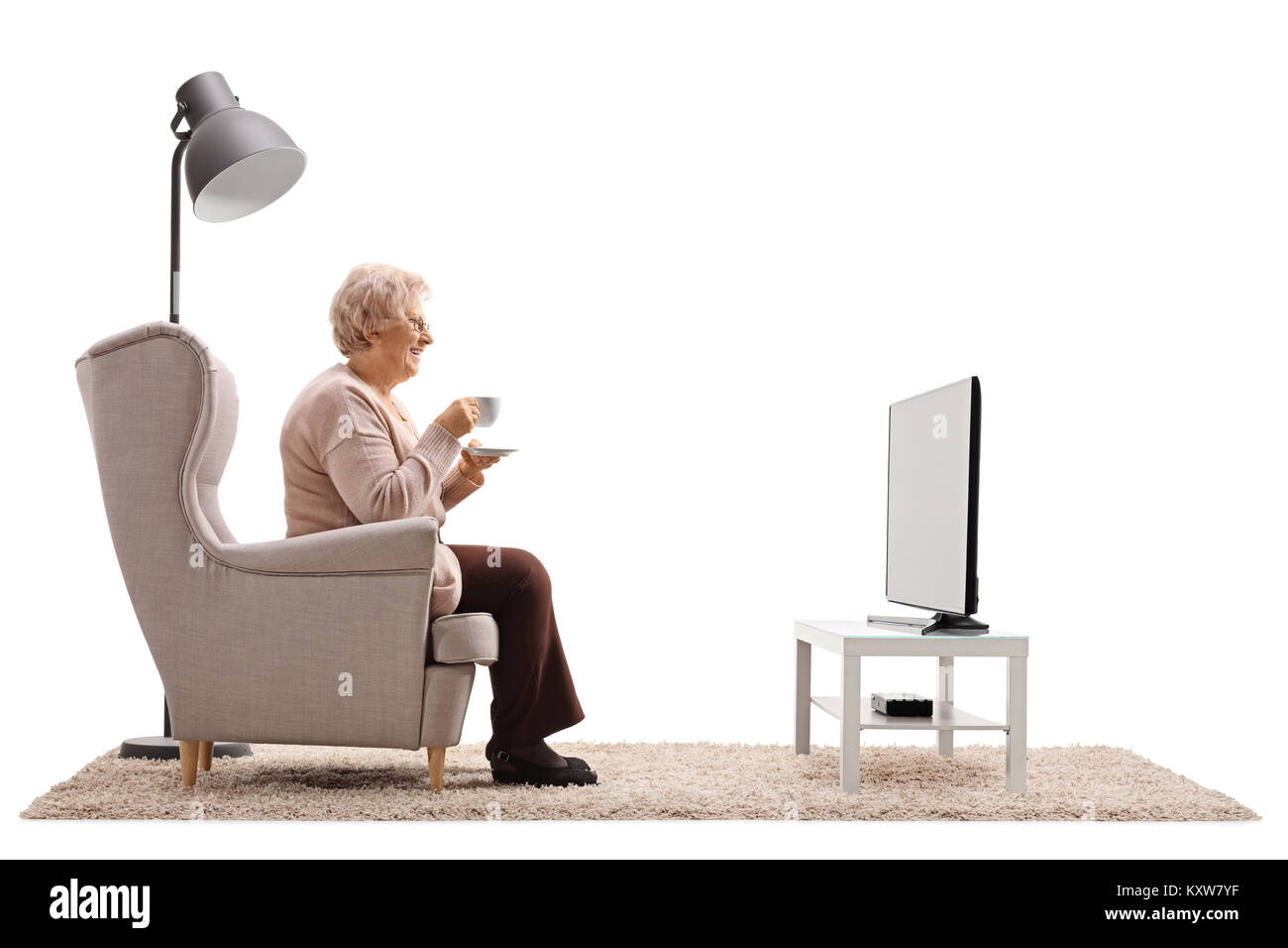Elderly woman seated in comfy chair hi-res stock photography and images ...