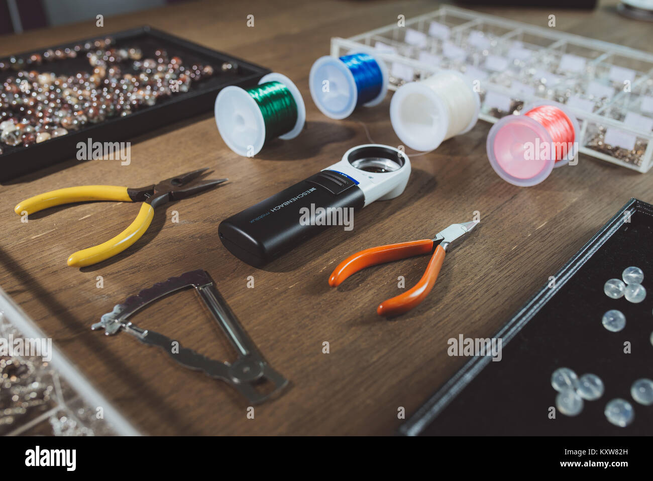 Tools for jewelry making, colorful stone beads. Jewellry workplace ...