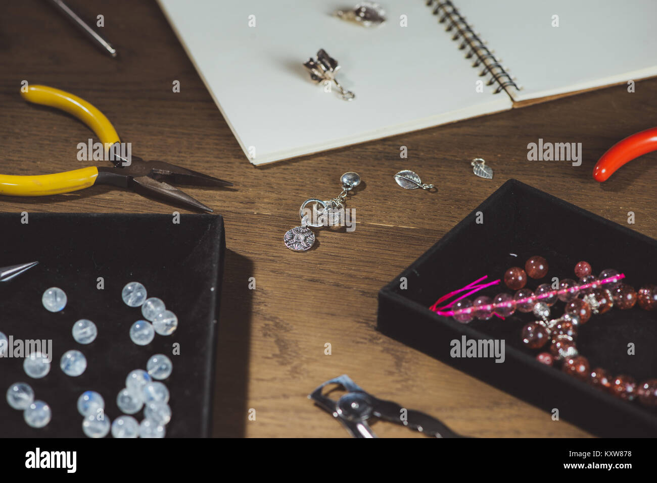 Tools for jewelry making, colorful stone beads. Jewellry workplace ...