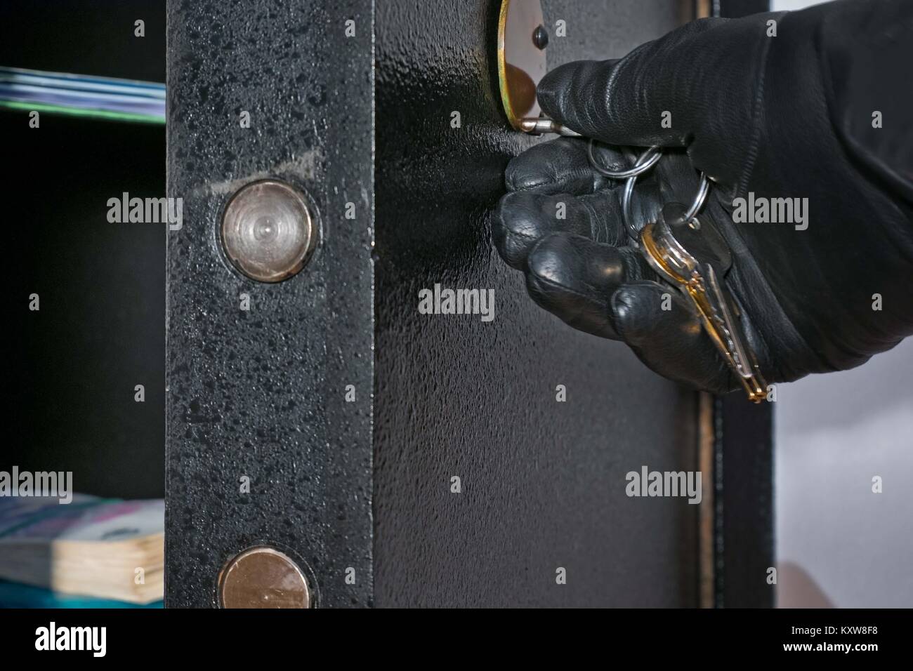 Detail of Open Safe with Hand of Thief Stock Photo - Alamy