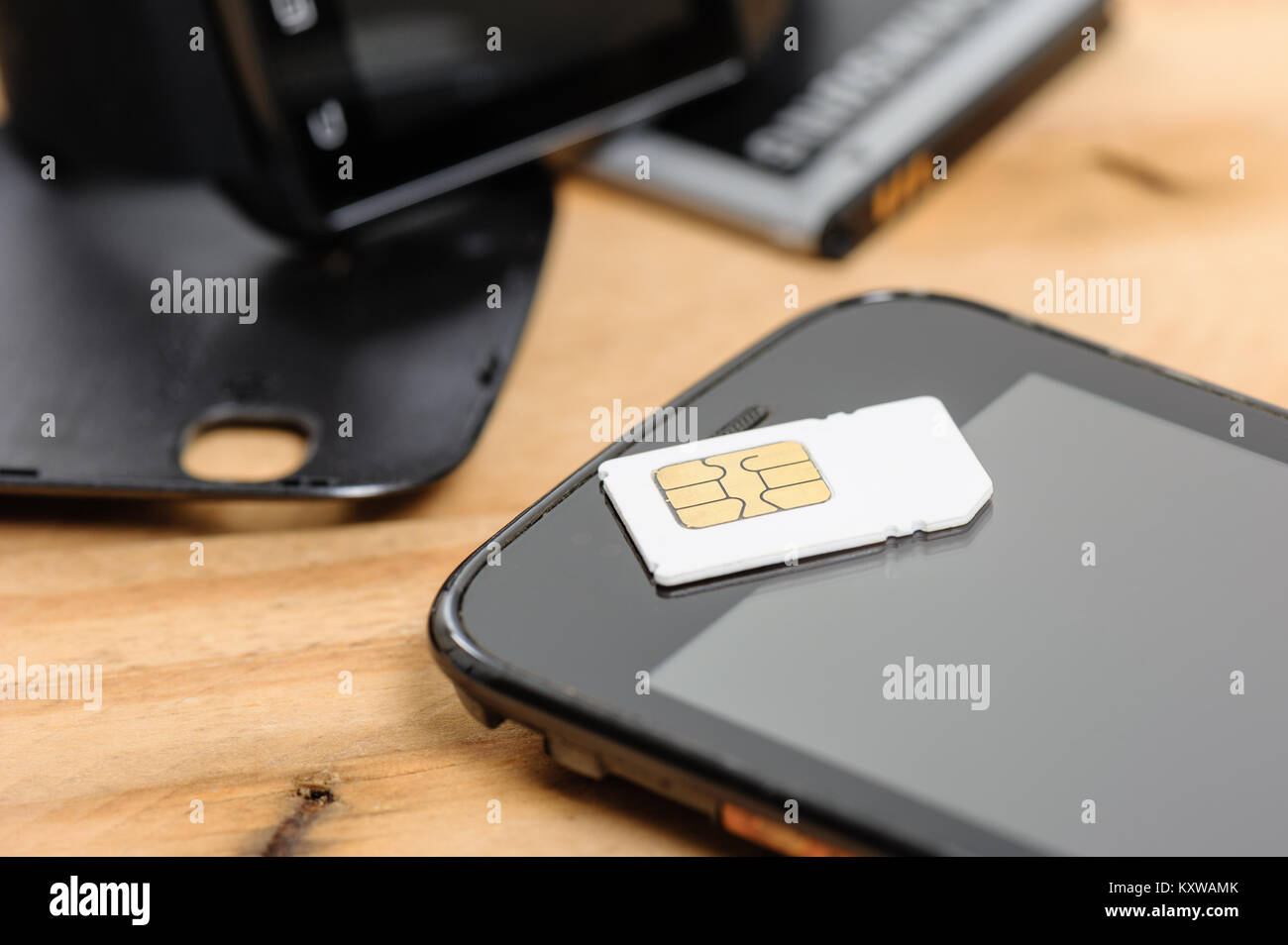 mini size of SIM card with smart phone Stock Photo - Alamy