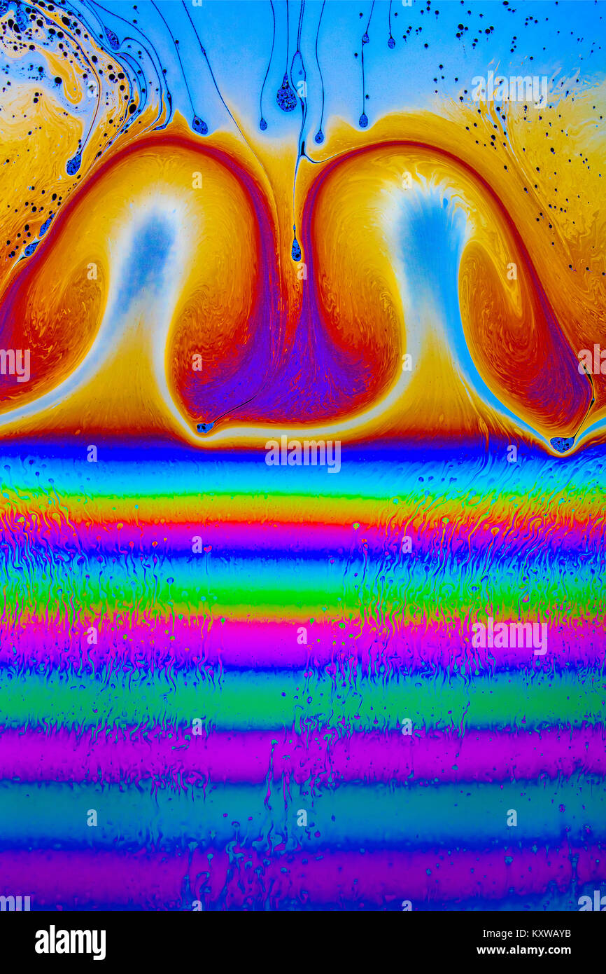 Optical thin film interference patterns in a stretched soap solution ...