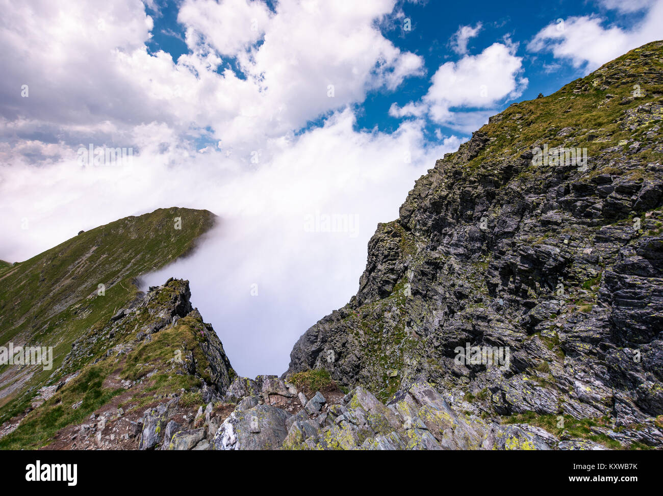 beautiful cloudscape over the cliffs of Fagarasan mountain ridge ...