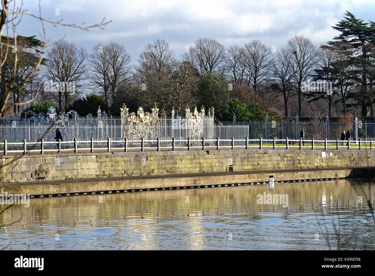Ornate Gold gates in Hampton Court Palace by the River Thames west ...