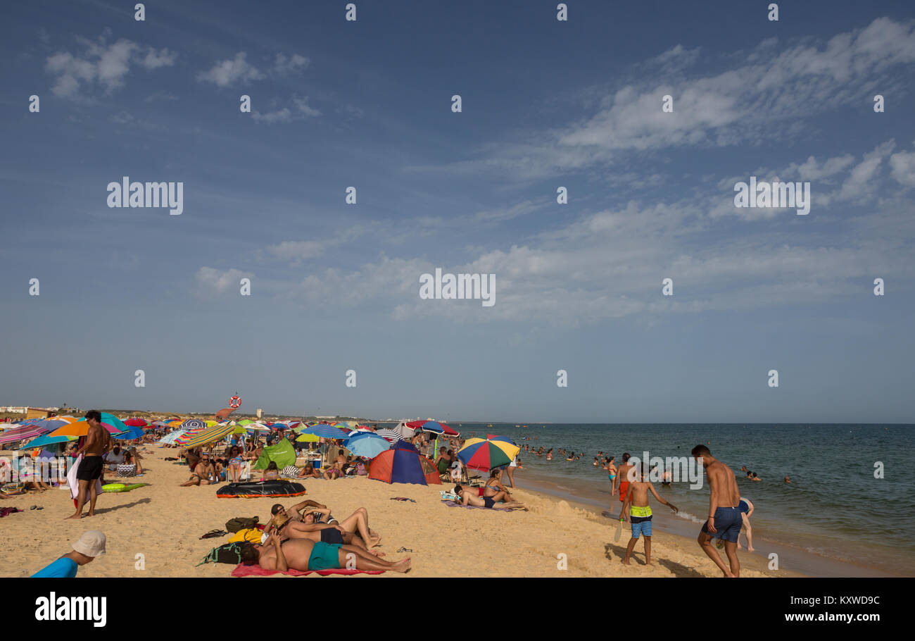 MANTA ROTA, PORTUGAL - AUGUST 25, 2017: People at the famous beach of ...