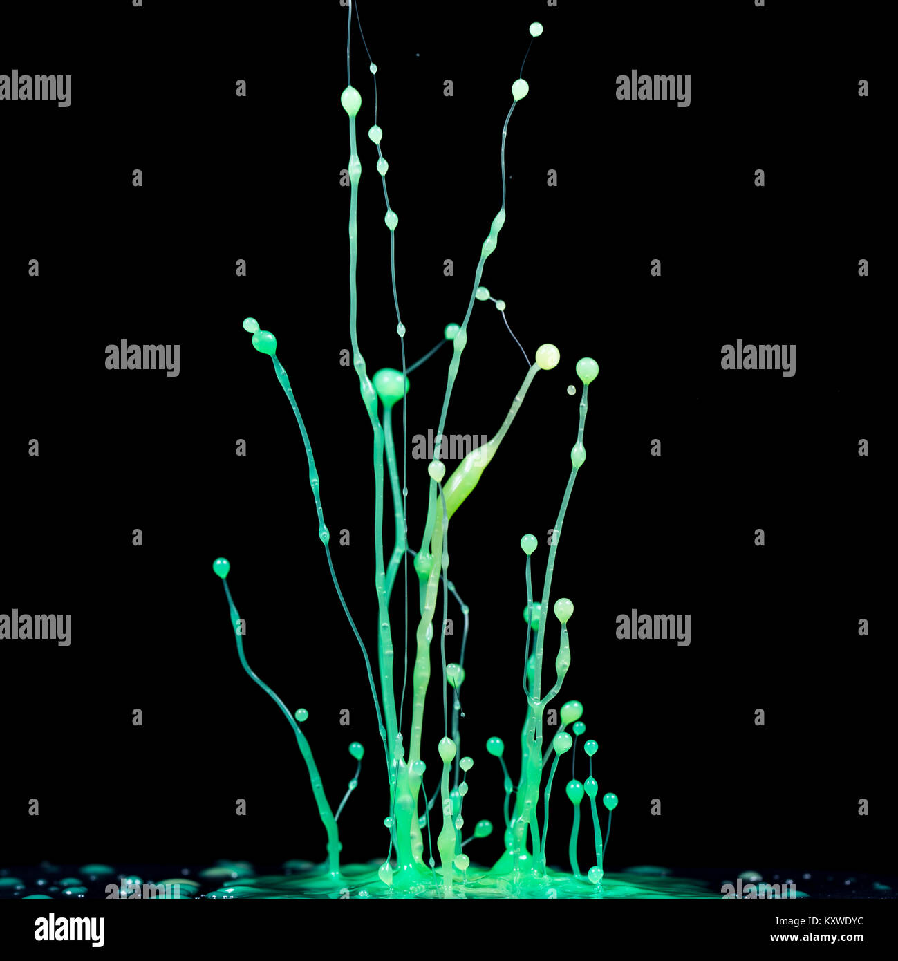 Bright paint bursts black water hi-res stock photography and images - Alamy