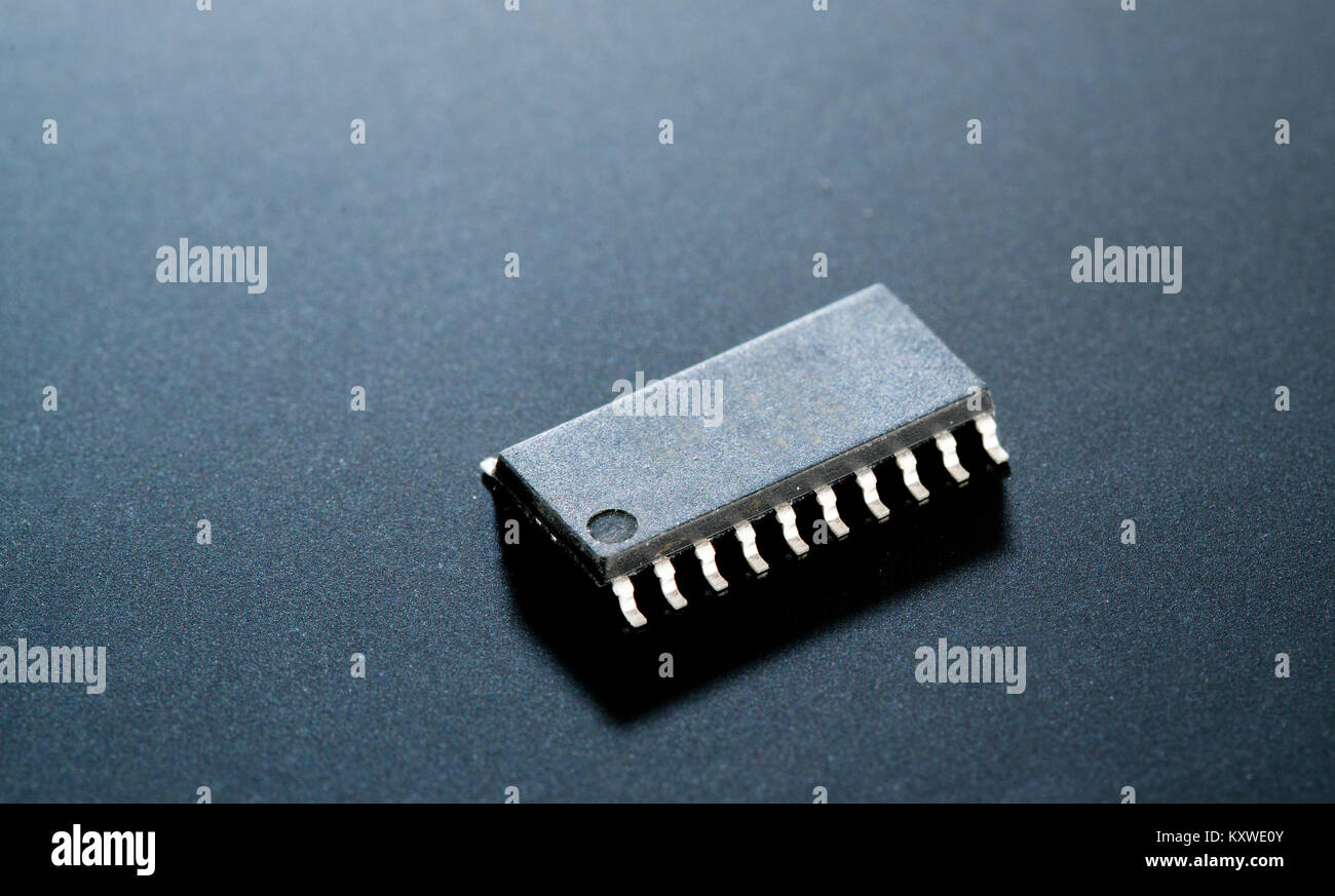 Electronic chip isolated on dark blue Stock Photo - Alamy