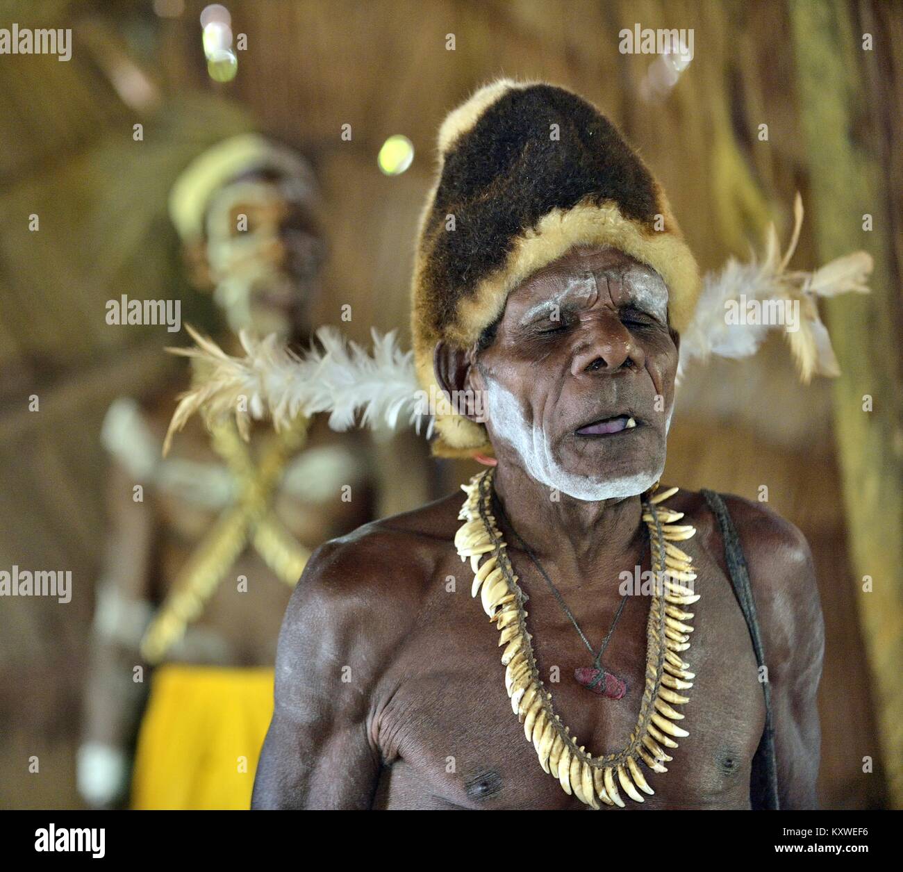 Portrait Of A Man From The Tribe Of Asmat People With Ritual Face