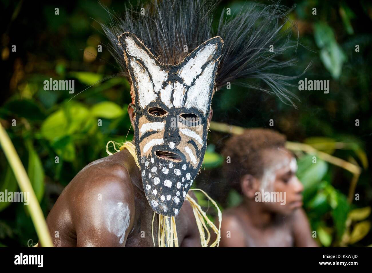The Canoe war ceremony of Asmat people. Headhunter of a tribe of Asmat ...