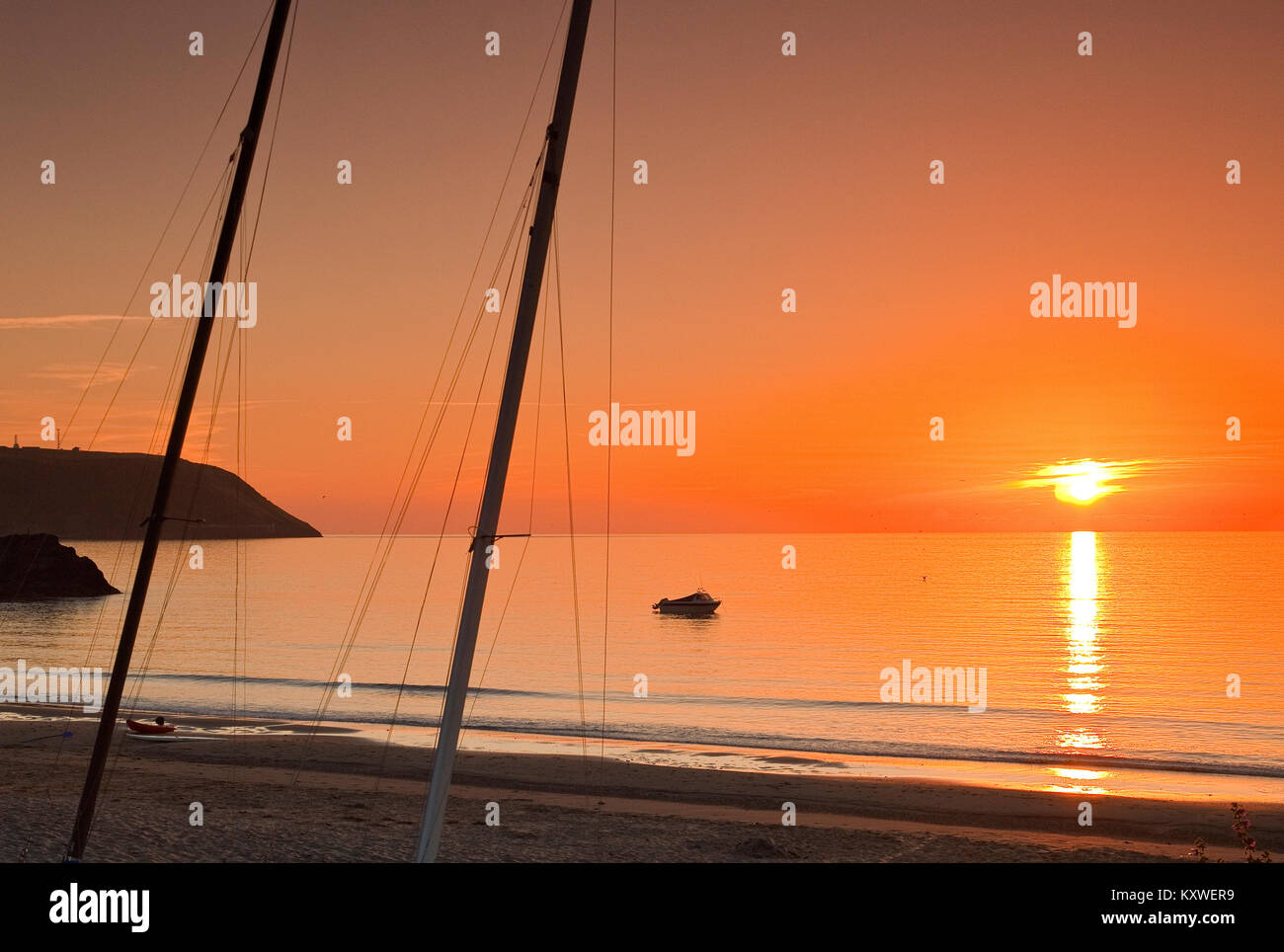 Photograph of silhouette mast, and rigging against a backdrop of a ...