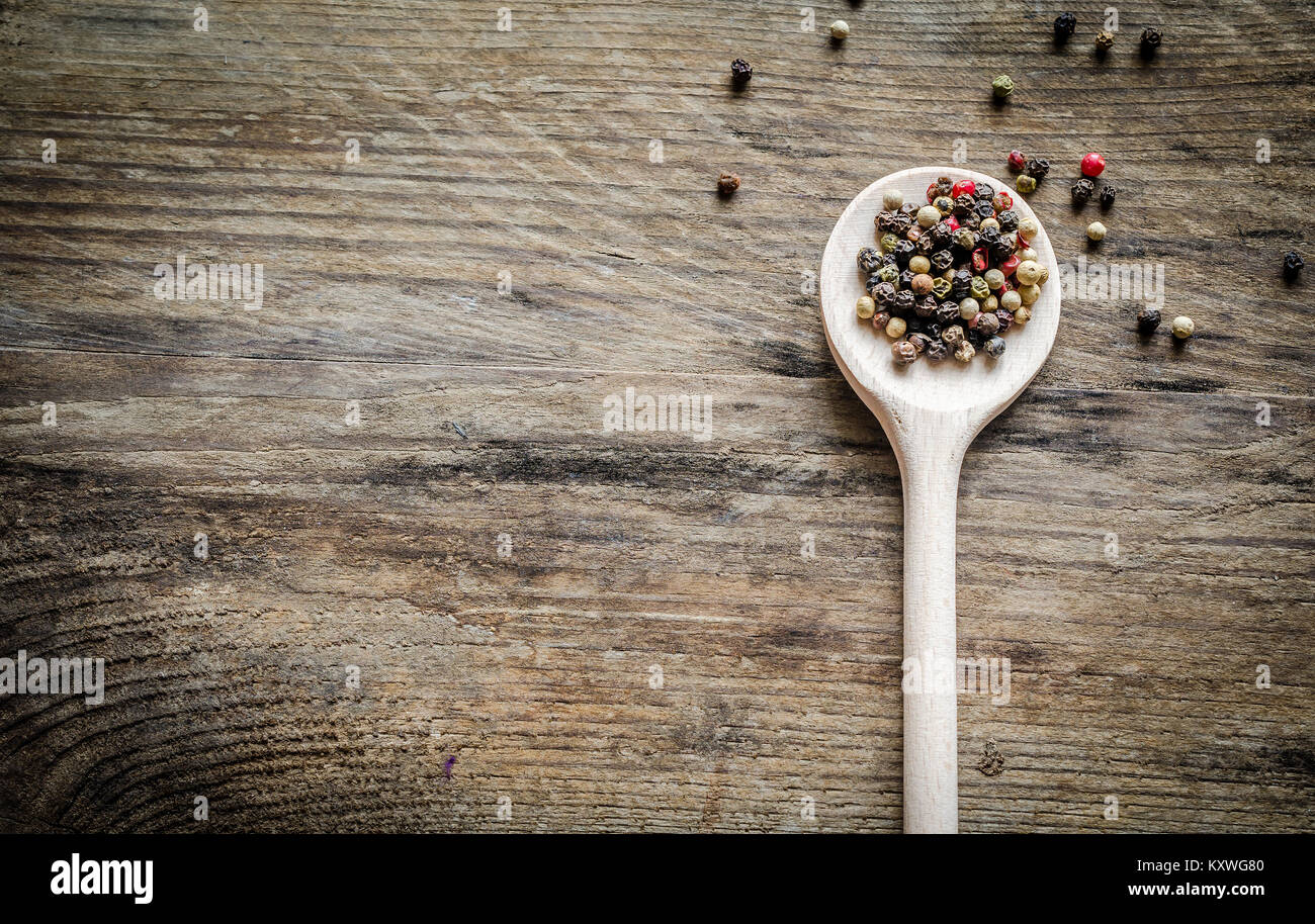 Wooden spoon with pepper Stock Photo - Alamy