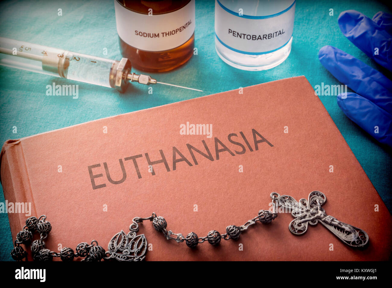 Vintage syringe and drugs used in lethal injection on a book of ...