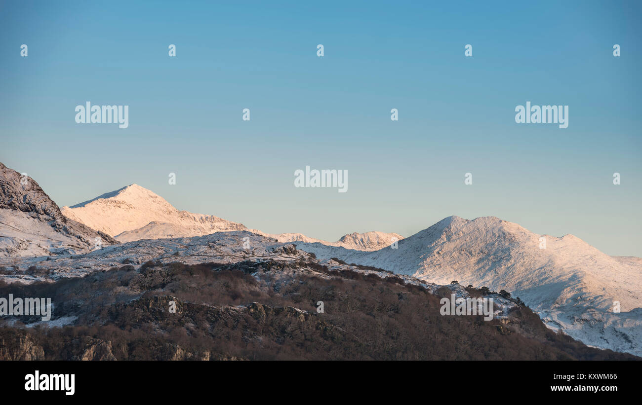 Beautiful Winter landscape image of Mount Snowdon and other peaks in ...