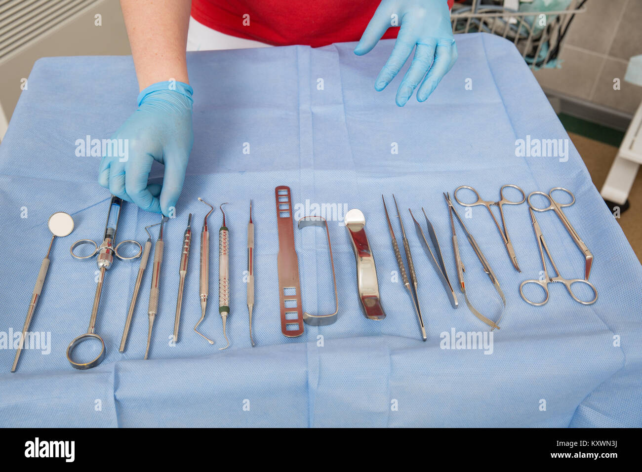 Detail of hand holding dental tools in dental clinic. Dentist concept ...