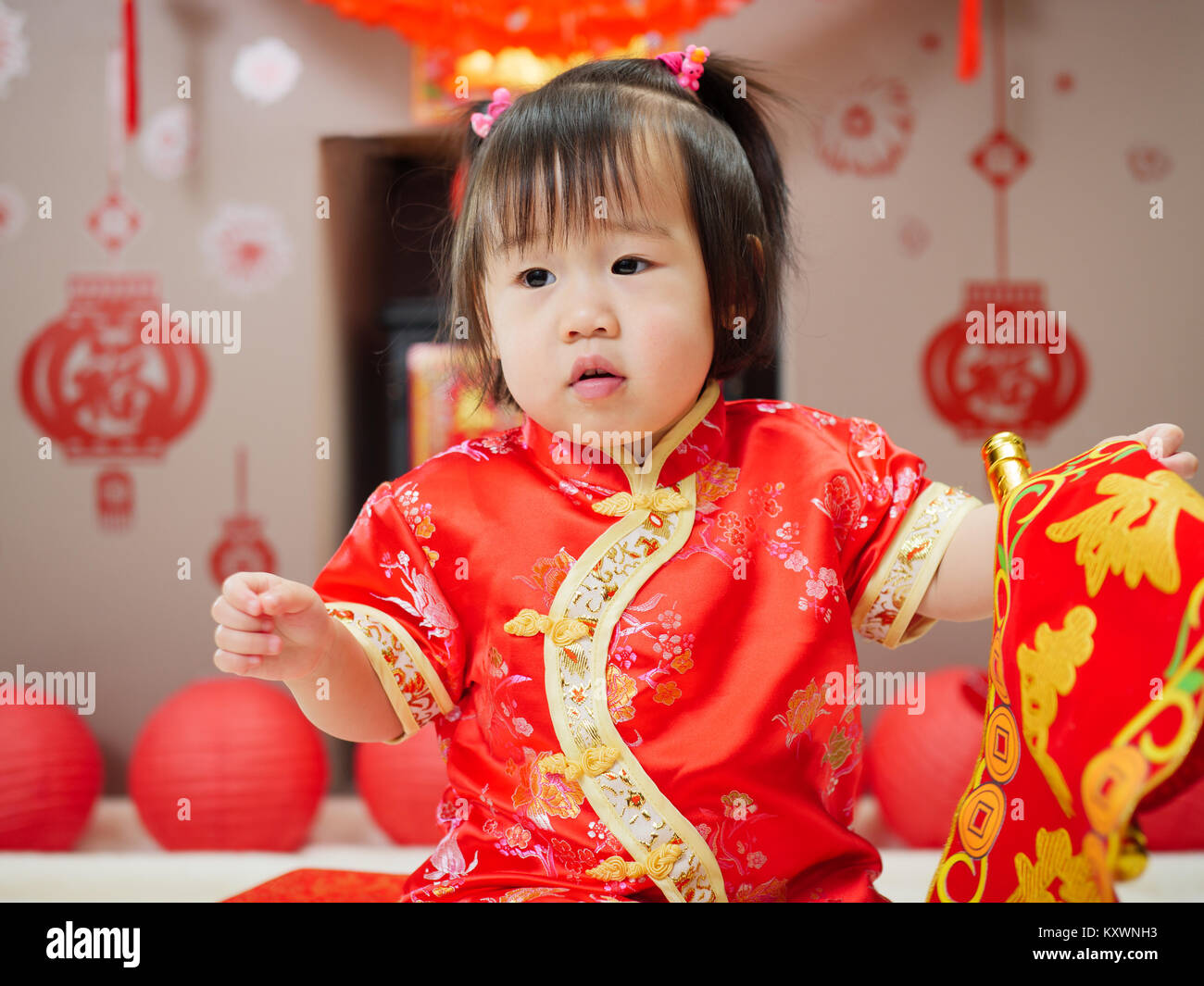 Chinese baby girl traditional dressing up with a "Gong Xi Fa Cha ...