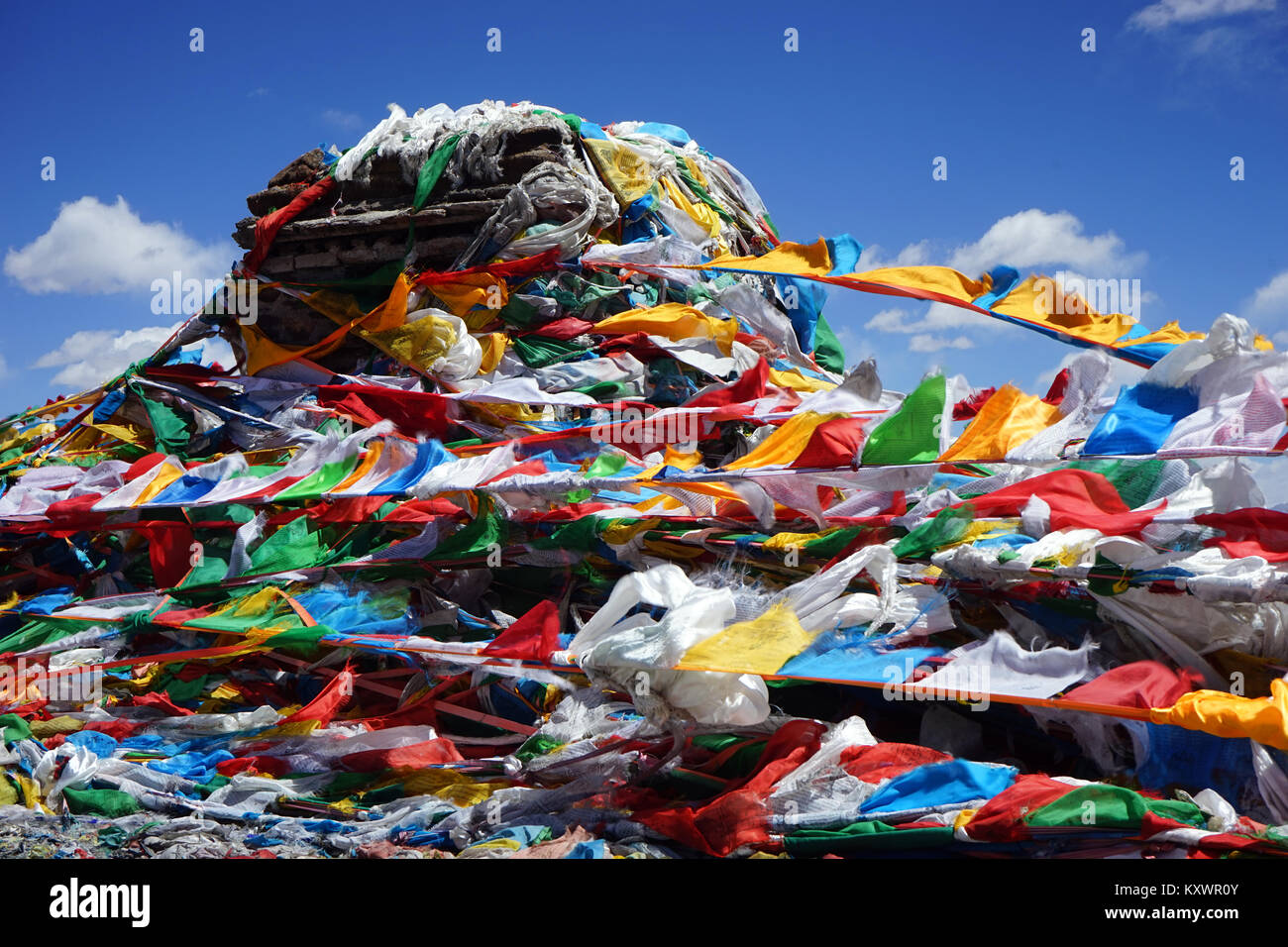 Color buddhist flags and stones in Tibet, China Stock Photo - Alamy