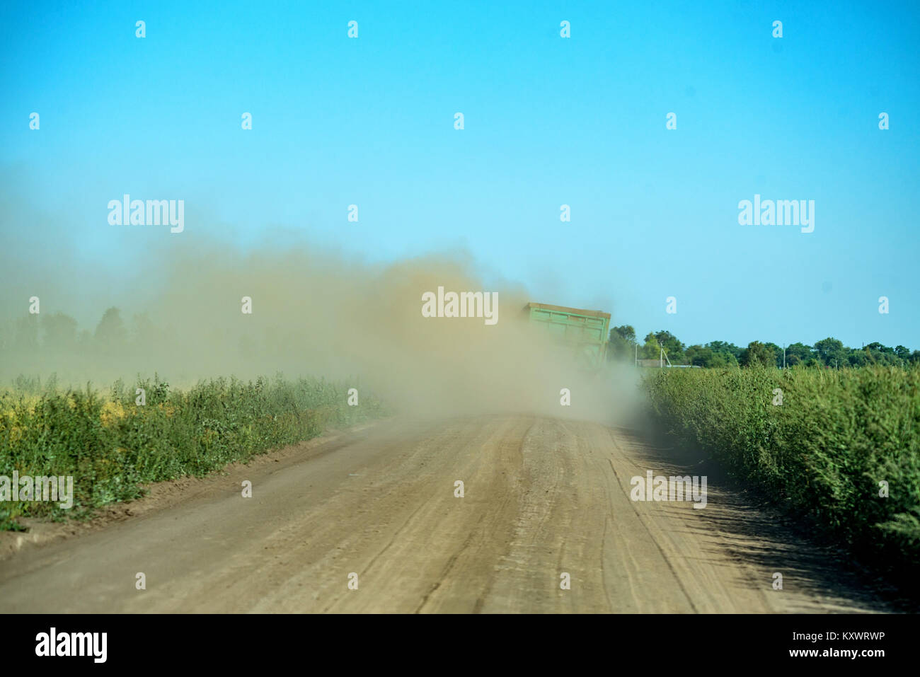 Rural road and dust after a car Stock Photo - Alamy