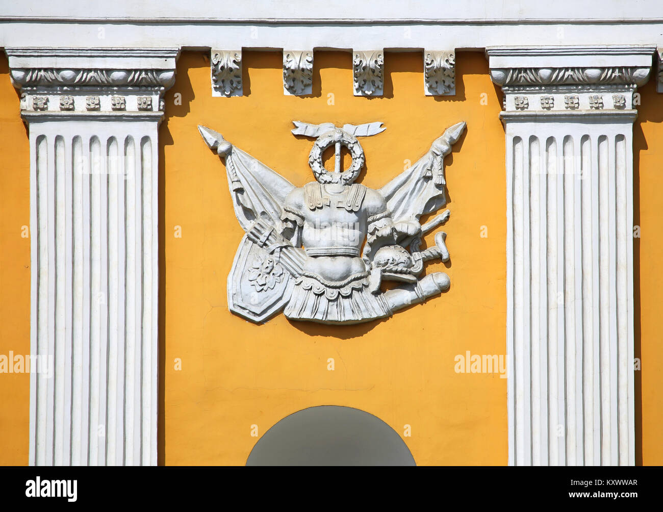 Fretwork in the form of an ancient crest on the wall of a historic ...