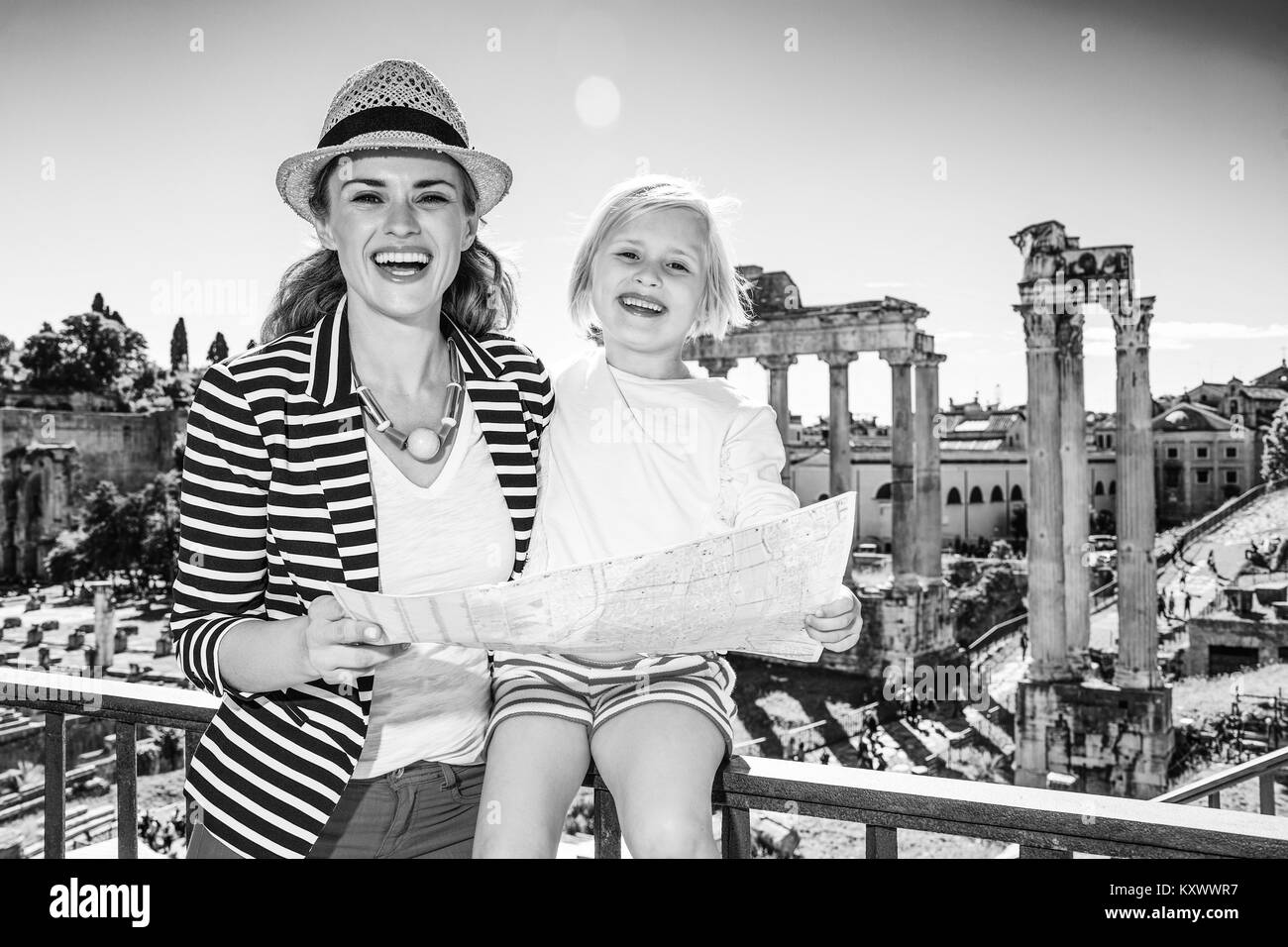 Roman Holiday. smiling young mother and daughter travellers in the ...