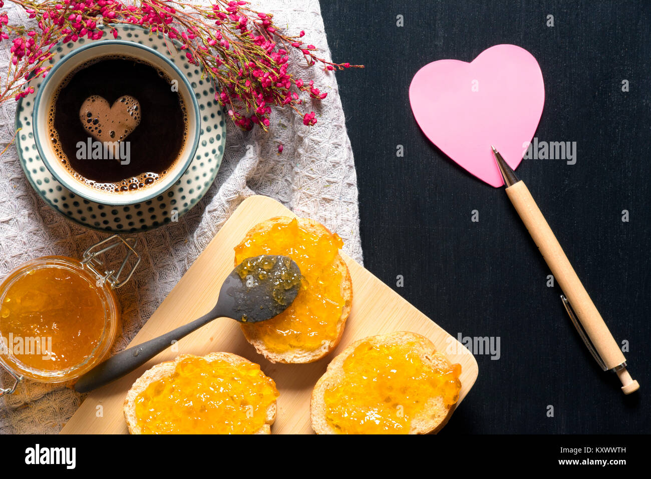 Romantic breakfast with flowers, heart shaped sticky note, bread with ...