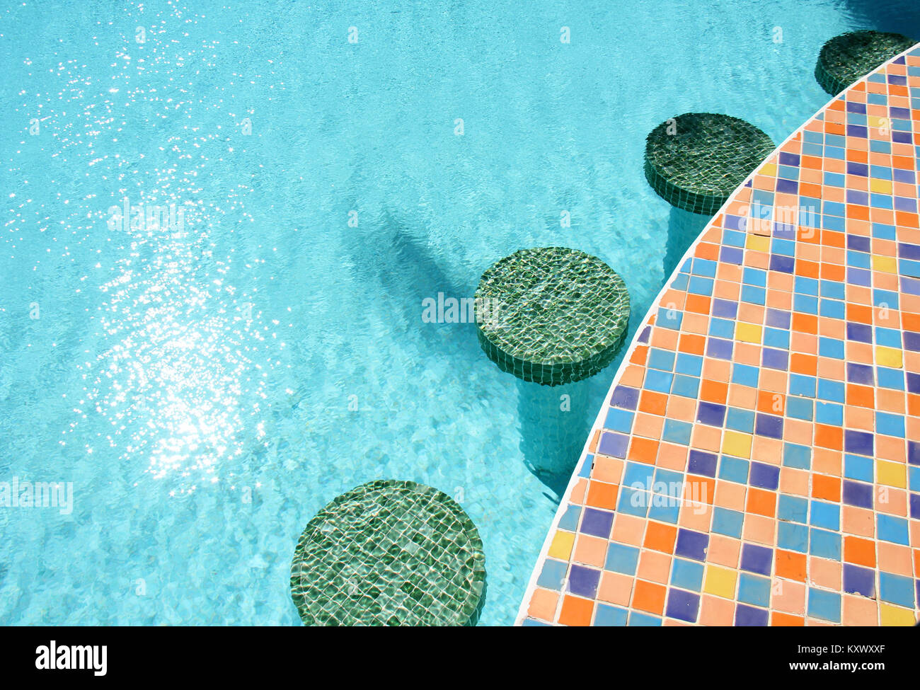 Colourful mosaic bar stools in a swimming pool Stock Photo - Alamy