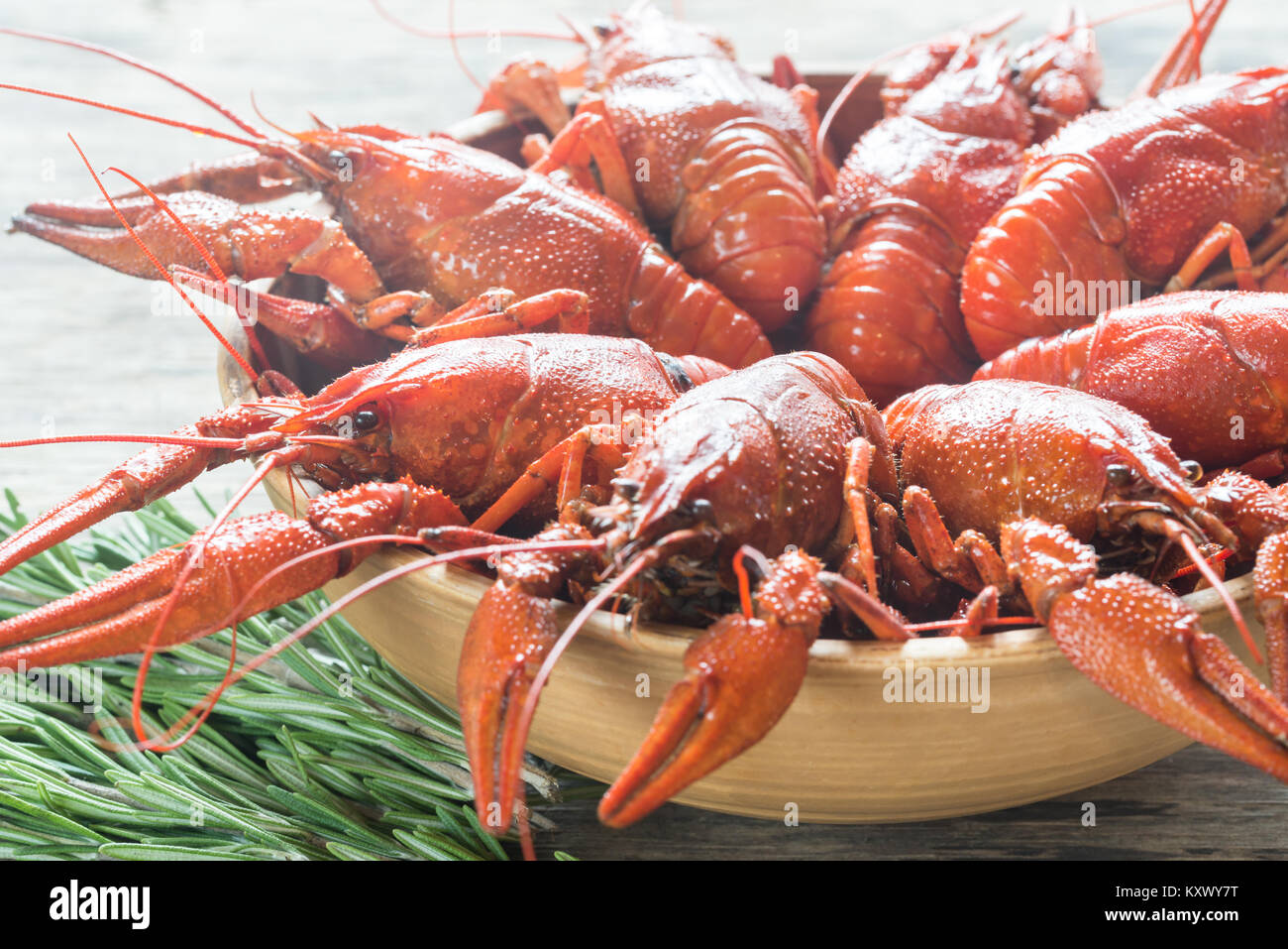 Bowl of boiled crayfish on the wooden table Stock Photo - Alamy