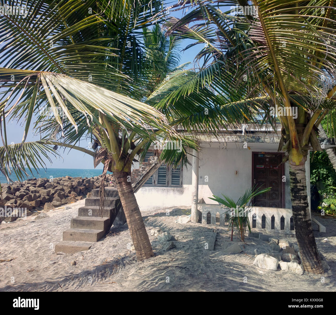 Old small cottage on shores of Arabian sea, opened right on beach ...