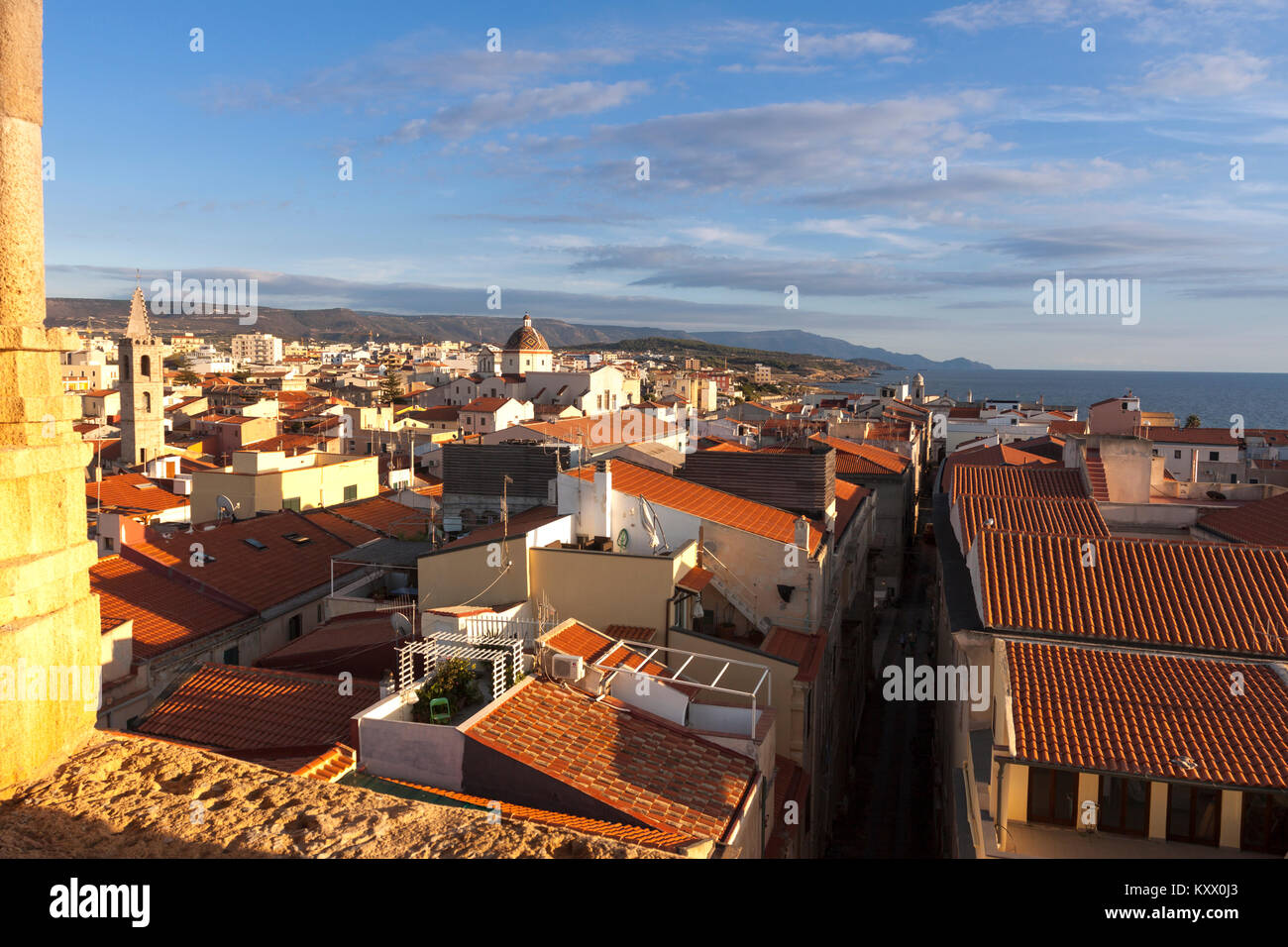 Aerial view of city against romantic skyline at sunset. Alghero ...
