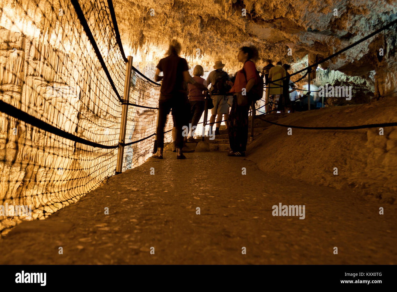 Tourists admire the incredible cave of Neptune. Alghero, Sardinia ...