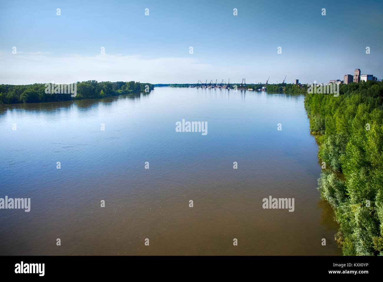 Navigable lowland river and small river port on North river. Willow on ...