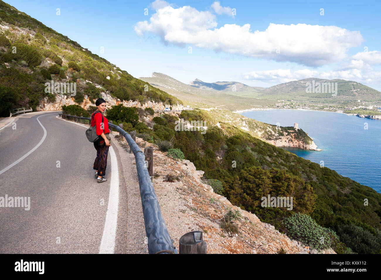 Young woman walking towards the Buru tower. Alghero, Sardinia. Italy ...