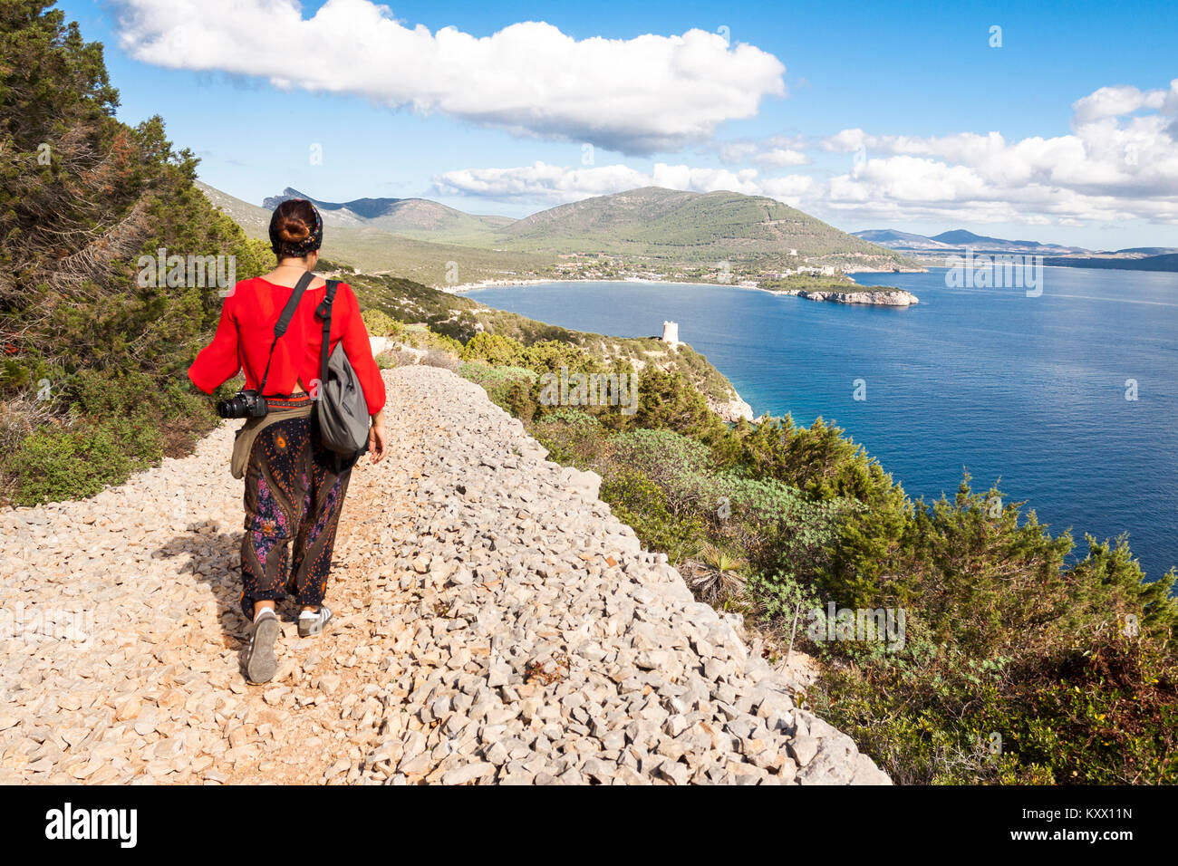 Young woman walking towards the Buru tower. Alghero, Sardinia. Italy ...