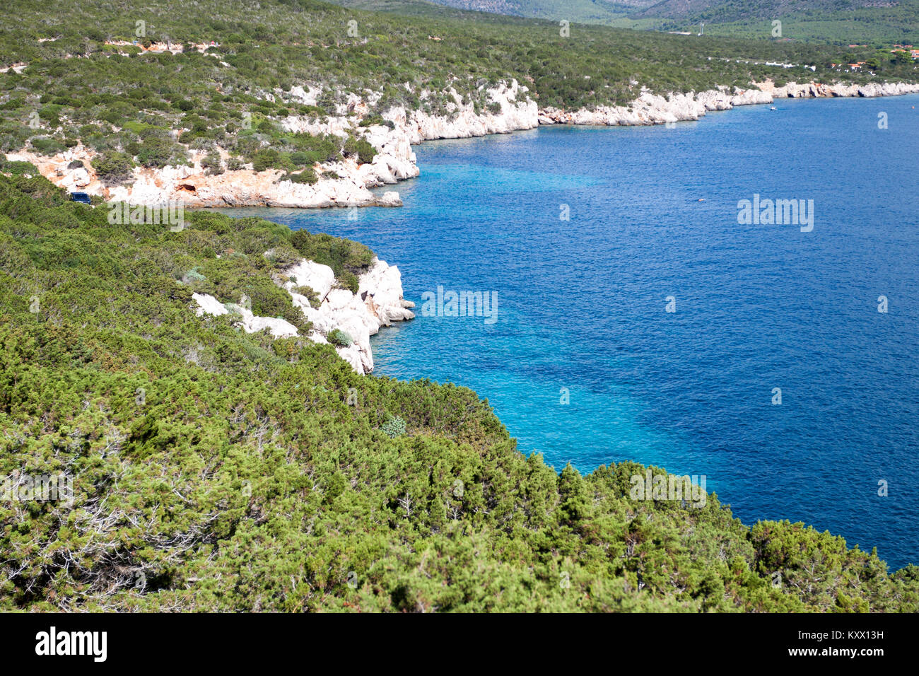 The deep blue of Cala Calcina. Alghero, Sardinia. Italy Stock Photo - Alamy
