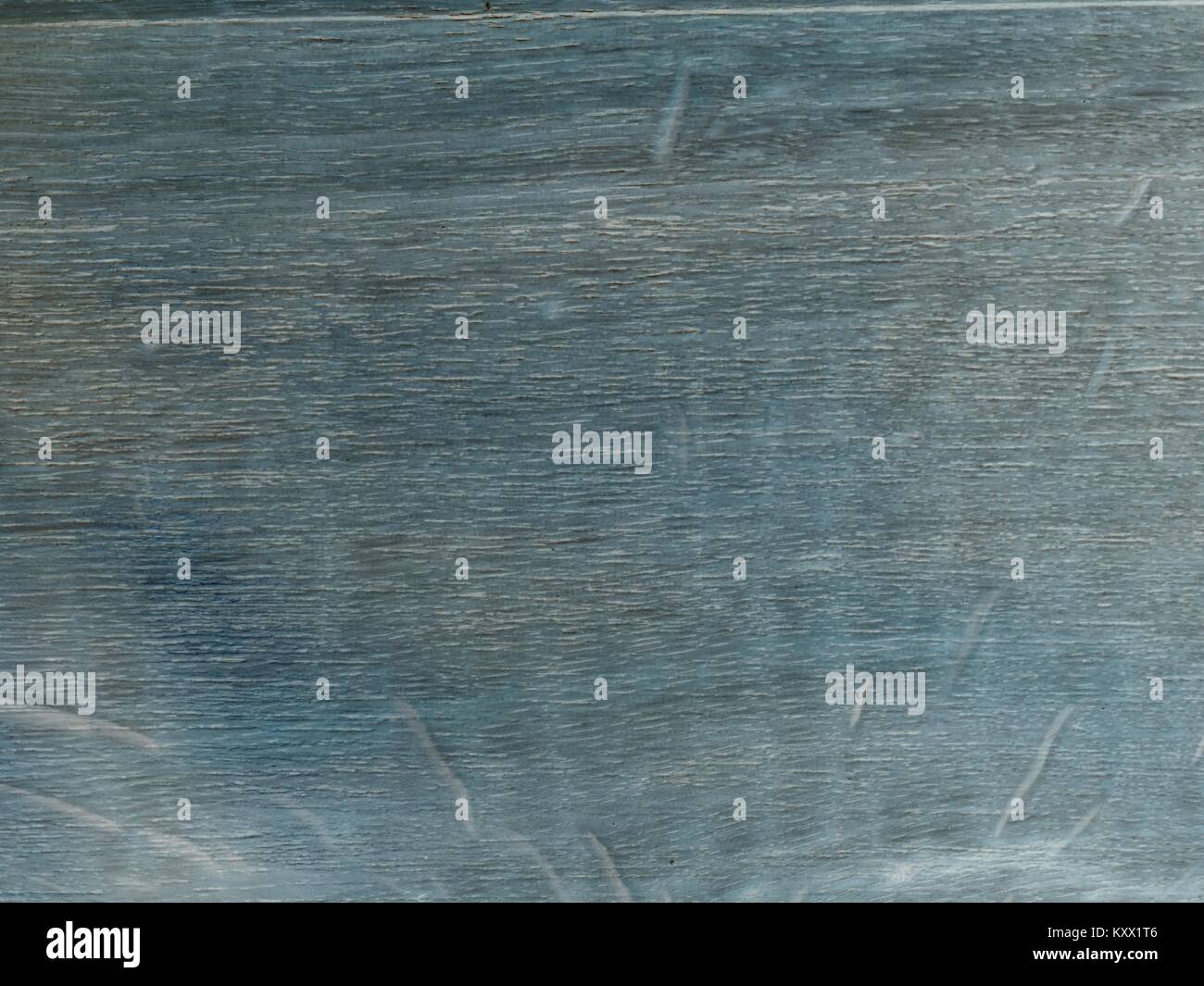 Clear structure of cherry wood saturated with blue stain, worn table ...