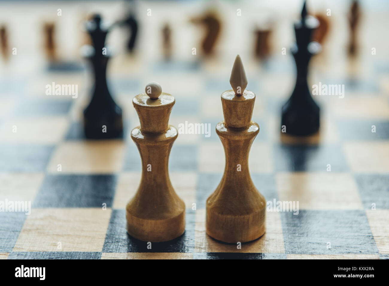 Closeup view of white chess king and queen figures on chess board Stock ...
