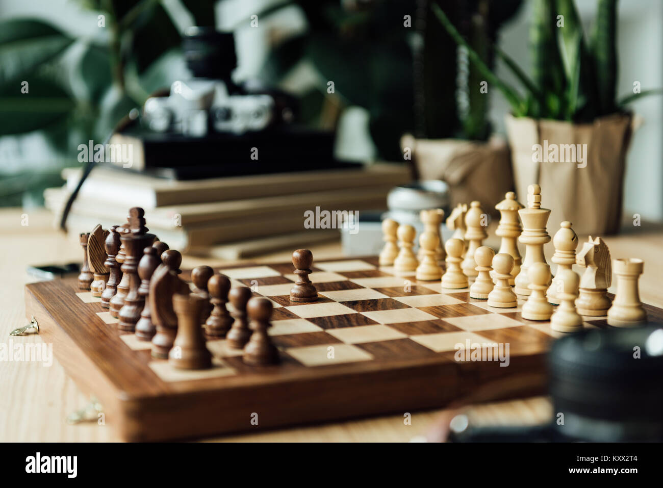 One black pawn staying against full set of chess pieces at the table ...