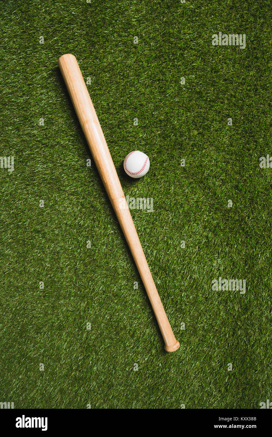 top view of baseball bat and ball on grass field Stock Photo - Alamy
