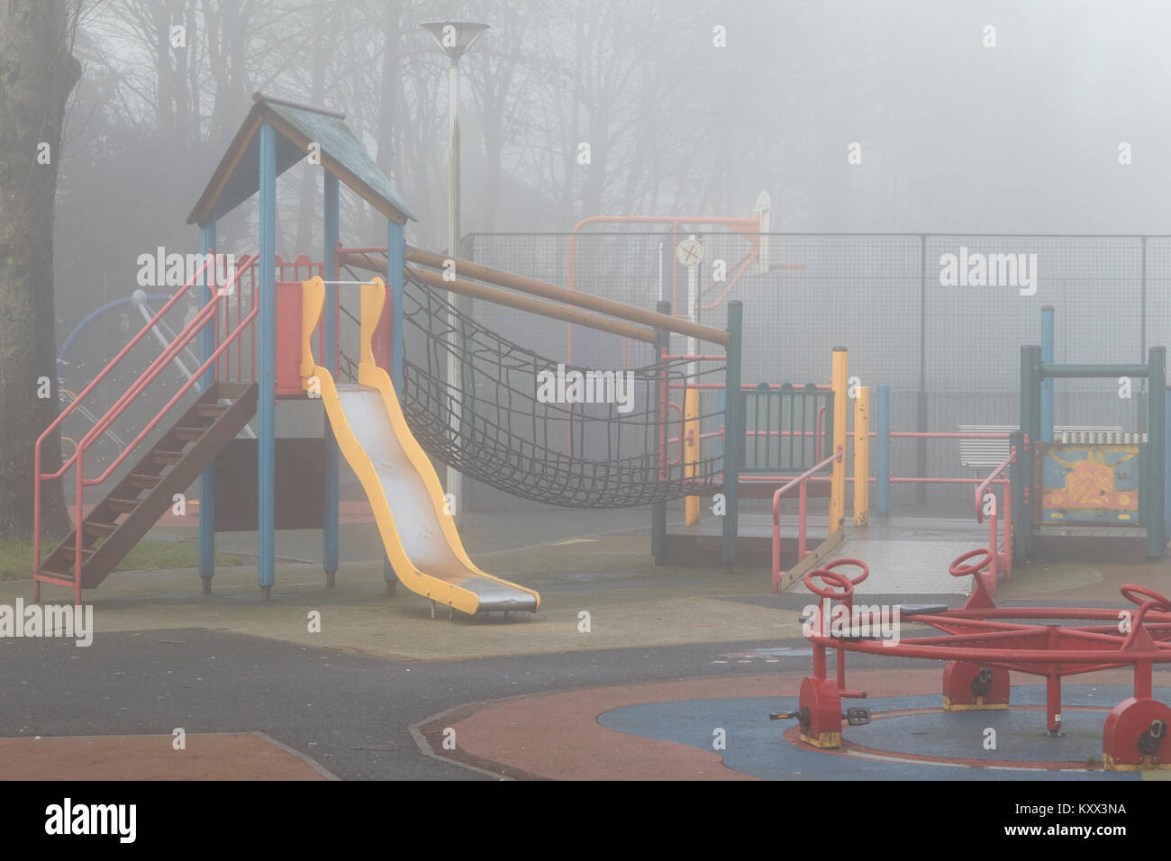 empty childs playground on a foggy day in the uk Stock Photo - Alamy