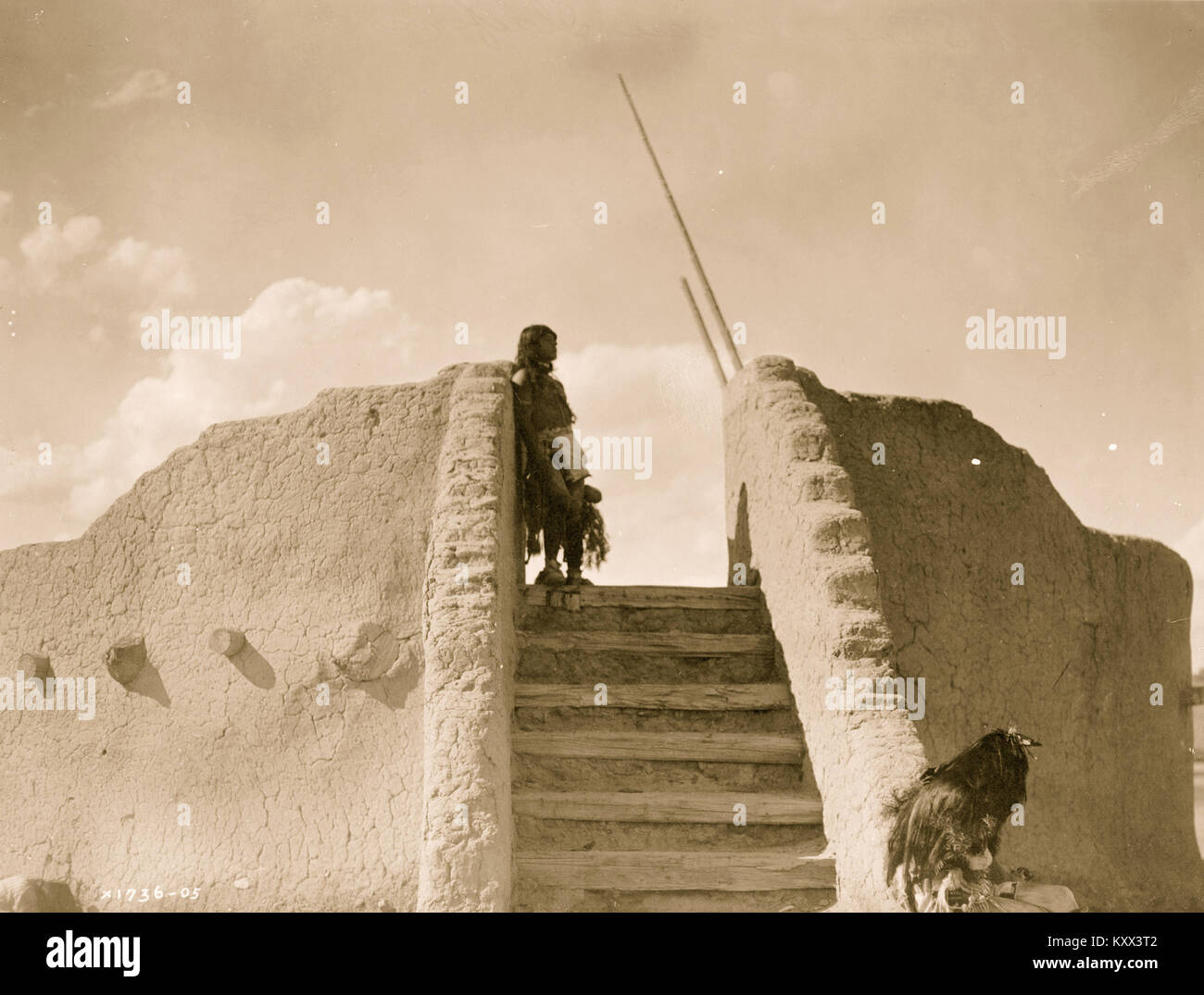 Tewa Indian guard at top of the kiva stairs, San Ildefonso, New Mexico ...