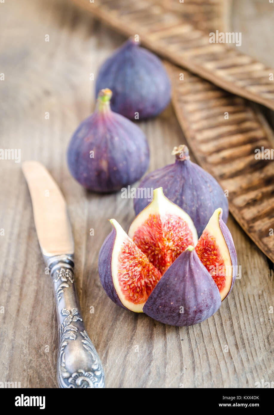 Honey pouring into cut fig Stock Photo - Alamy