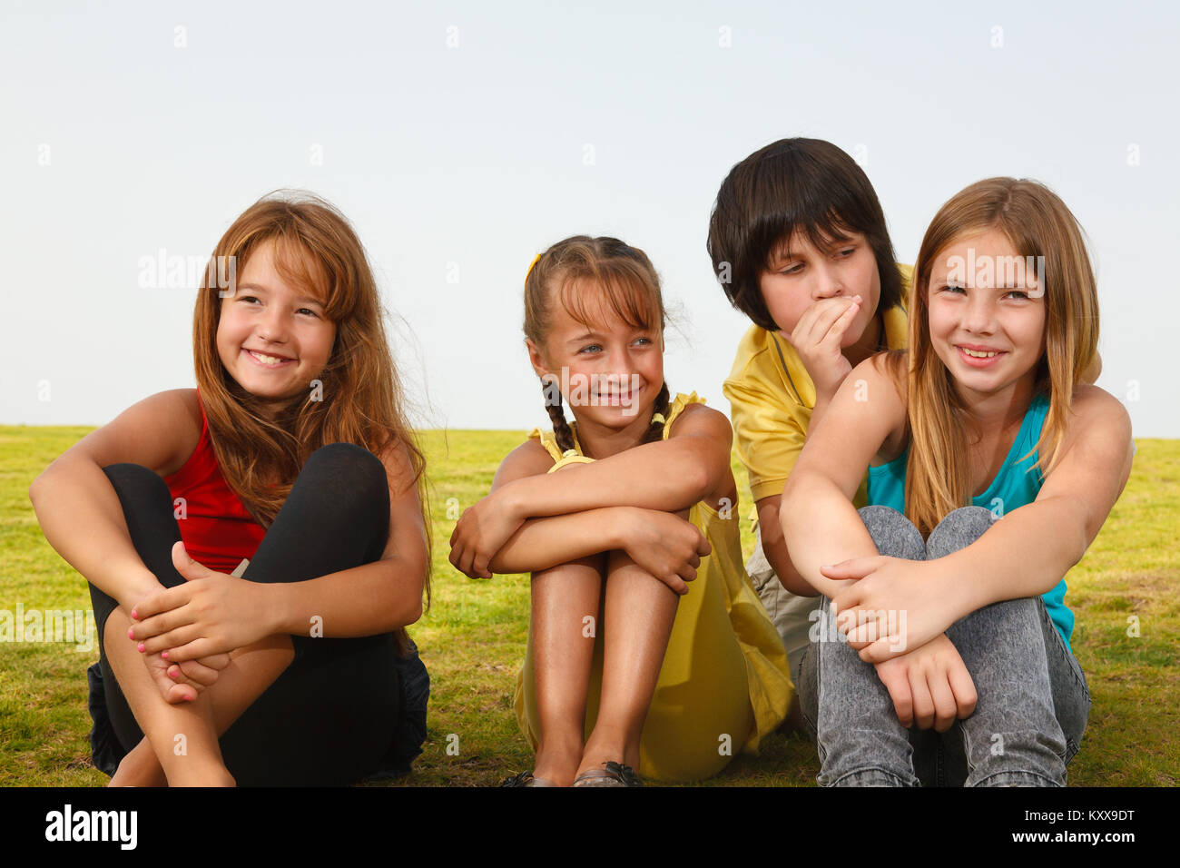 Group of four happy children outdoors Stock Photo - Alamy