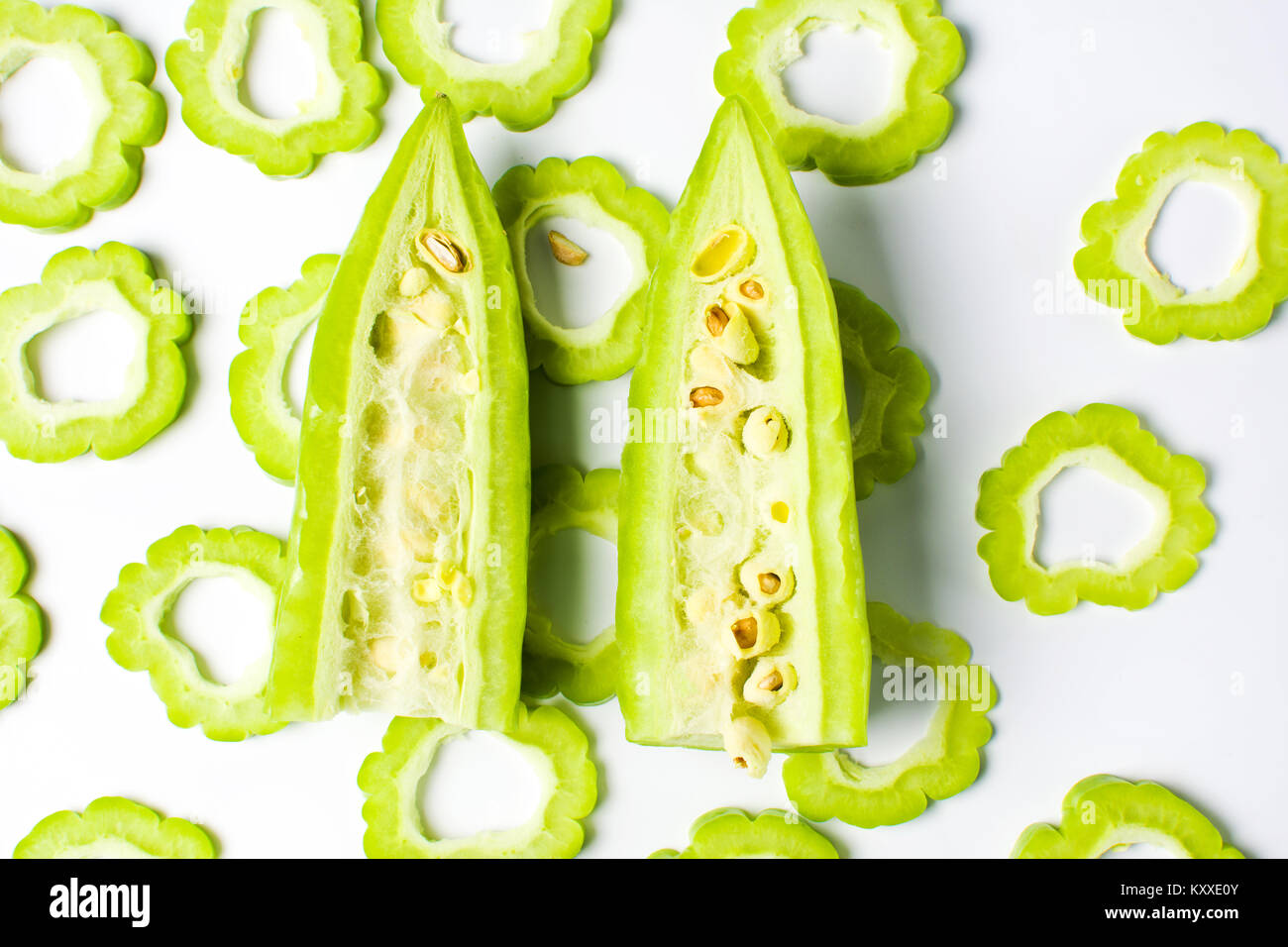 Sliced bitter melon gourd on white background Stock Photo - Alamy