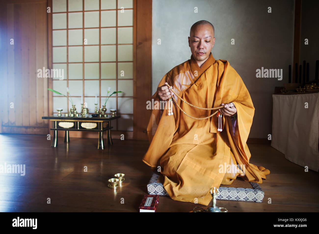 Man in robe kneeling hi-res stock photography and images - Alamy