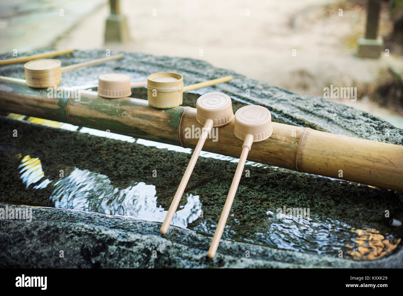 Close up of bamboo water hand washing basins at Shinto Sakurai Shrine ...